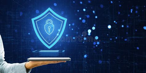 A Digital Cybersecurity Shield Floating Above A Tablet Held By A Person Against A Circuitry