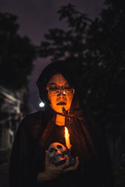 Premium Photo Portrait Of Woman Wearing Glasses Standing At Night