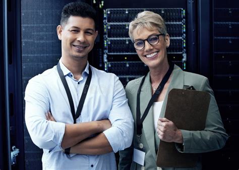 computer center mature woman and data engineer with clipboard