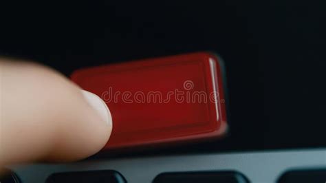 Finger Poised To Press Large Red Delete Key On Computer Keyboard