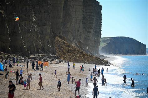 England Beach Goers Witness Major Rockfall Over The West Bay