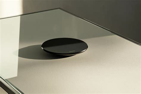 Minimalist Black Object On Light Surface Photo On Lummi