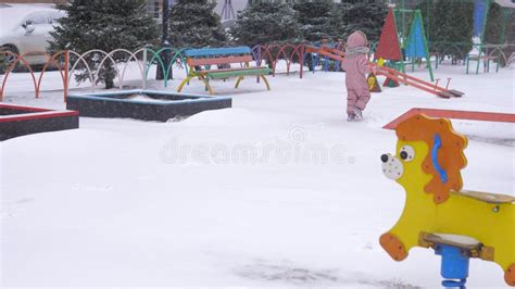 Siblings 5 Years Old Sister And 3 Years Old Brother Enjoying Winter