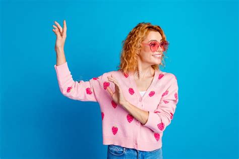 Photo Of Attractive Young Woman Touch Sunglass Have Fun Look Empty