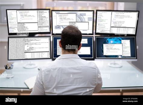 Software Developer Programming On Computer Monitor Screens Stock Photo Alamy