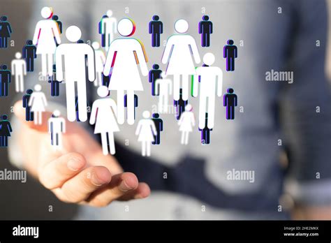 Businessman Holding A Floating Render Of Gendered Profile Icons Network