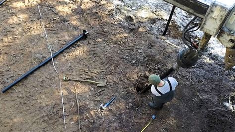 Premium Photo Workflow Clip Laying Of Pipelines A Man In A Helmet Does Work With The Help Of