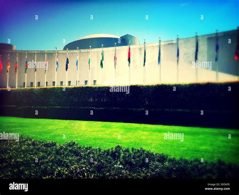 United Nations General Assembly Building And Member Nation Flags Stock