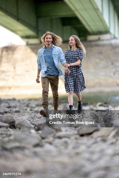 People Walking Under Bridge Photos And Premium High Res Pictures