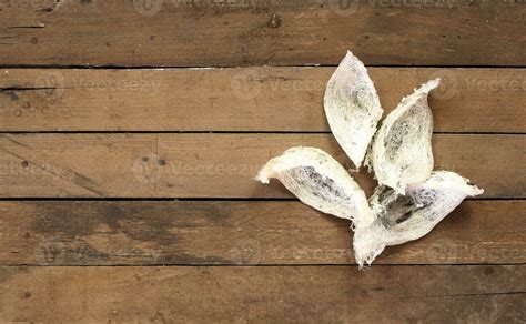 Top View Edible Swiftlet Nest On Brown Wooden Raw Edible Birds Nest Materials Before Remove