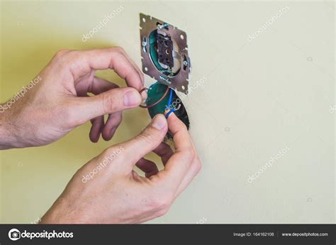 Electrician Installing Socket In New House Stock Photo Galitskaya 164162108