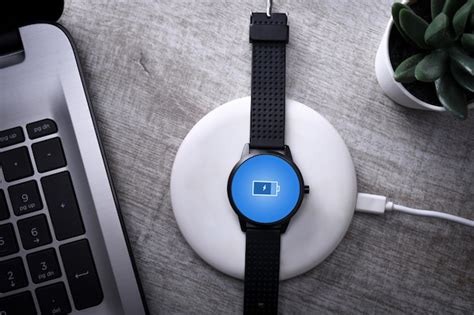 Premium Photo | Smart watch on wireless charging with on-screen ...