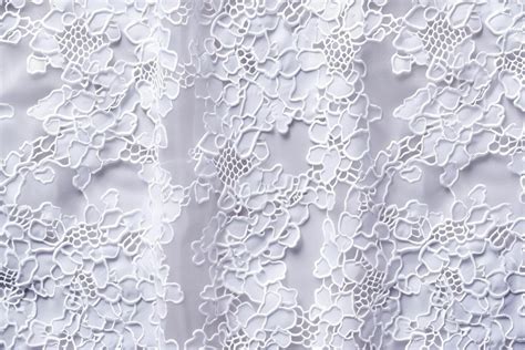 A Delicate White Lace Texture Background Featuring Intricate Patterns