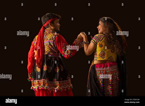 A Gujarati Couple Dressed In A Traditional Gujrati Attire During The