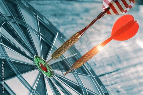 Close Up Shot Of The Red Dart Arrow Hit On Bulleyes Of Dartboard To Represent That The Business