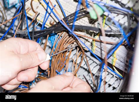 Engineer Hands Installing Electrical Components In Fuse Box Industry Measuring Voltage Stock