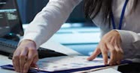 Vertical Video Engineer In Data Center Installing Software On Computer