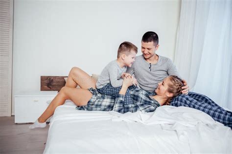 Mom Dad And Son Lie On The Bed At Home Dream Stock Image Image Of