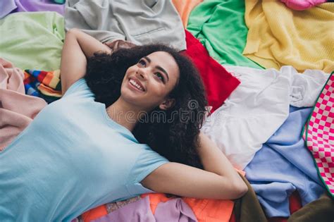 Above View Photo Of Nice Young Girl Laying Messy Clutter Clothes
