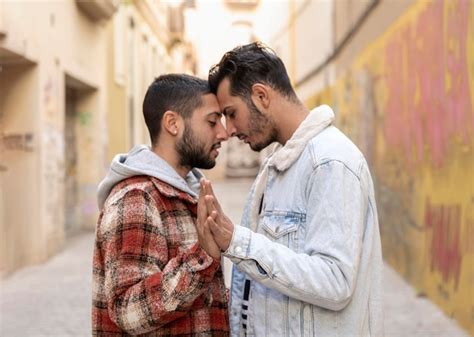 Premium Photo Gay Men Standing Face To Face With Eyes Closed And