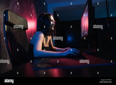 A Cute Female Gamer Girl Sits In A Cozy Room Behind A Computer And Plays Games Woman Live