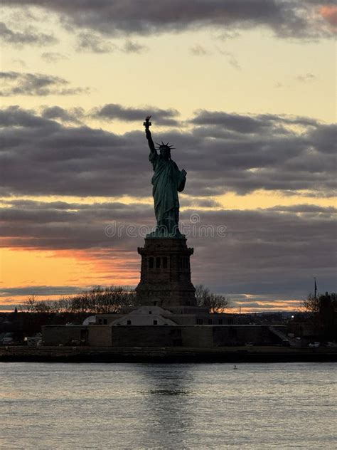 Majestic Sunset View Of The Statue Of Liberty In New York Editorial