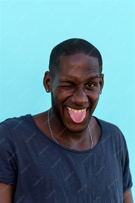 Premium Photo Portrait Of A Funny African Man In Front Of A Colorful Wall