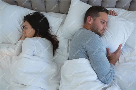 premium photo angry couple avoiding each other in bedroom
