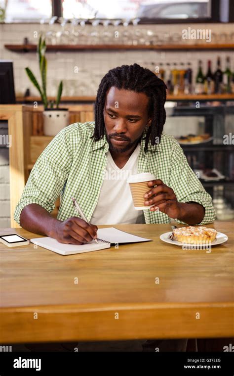 Man Writing In A Notebook Stock Photo Alamy