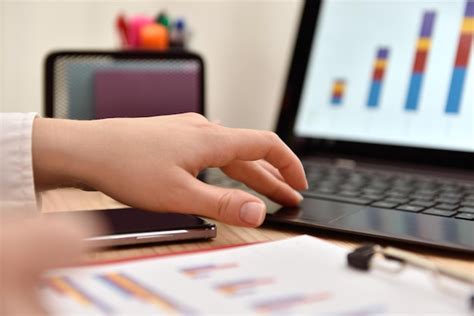 premium photo trader analyzing income charts and graphs