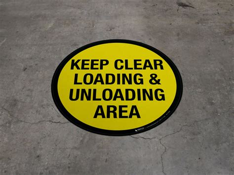keep clear loading and unloading area floor sign