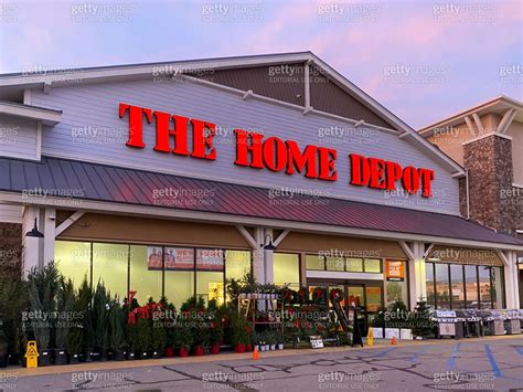 The Home Depot Store Entrance With Colorful Sunset In The Background In