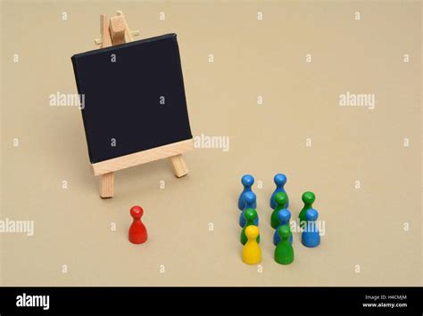 Students And Teacher In Classroom Concept With Colorful Dice Stock