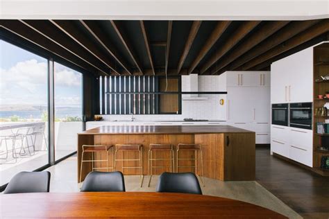 Modern Open Kitchen And Dining Room With Ocean View