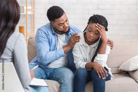 Loving Husband Supporting His Depressed Wife During Psychotherapy