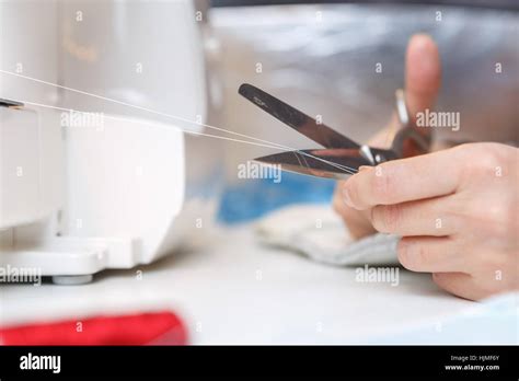Girl With Scissors Cuts Thread Stock Photo Alamy