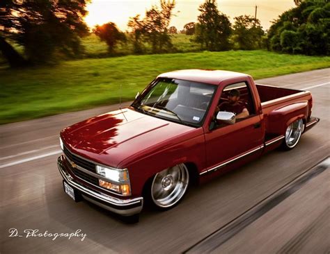 Red Chevy Pickup Truck Rolling Down The Road