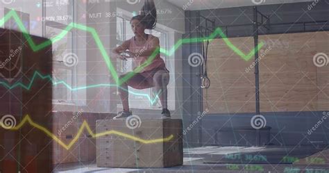 Image Of Graph Processing Data Over Caucasian Woman Jumping On Box Cross Training At Gym Stock