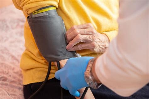 Premium Photo A Doctor Using A Sphygmomanometer With A Stethoscope Revealed Arterial Hypertension