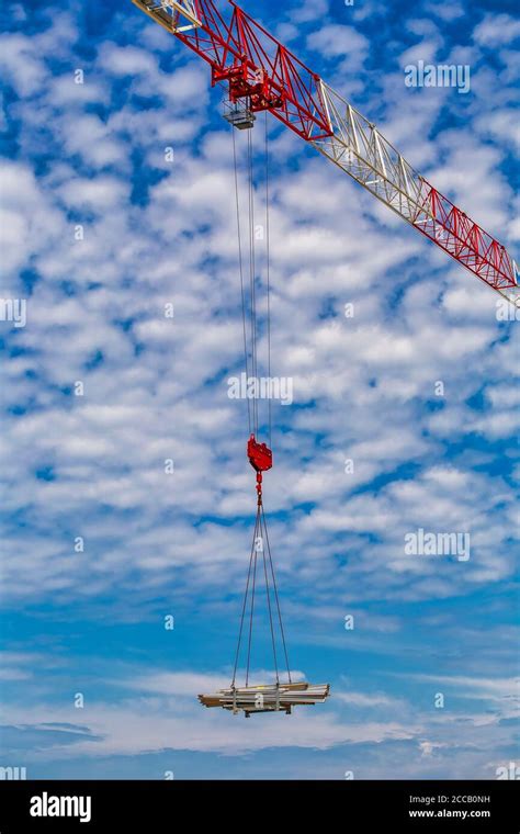 Crane Lifting Scaffolding Elements For Installing With Sky Background Crane Lifting Scaffolding Elements For Installing With Sky Background