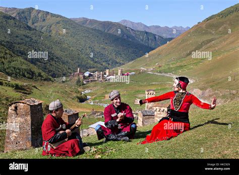 Georgian People In National Costumes Sing And Dance In Ushguli Georgia