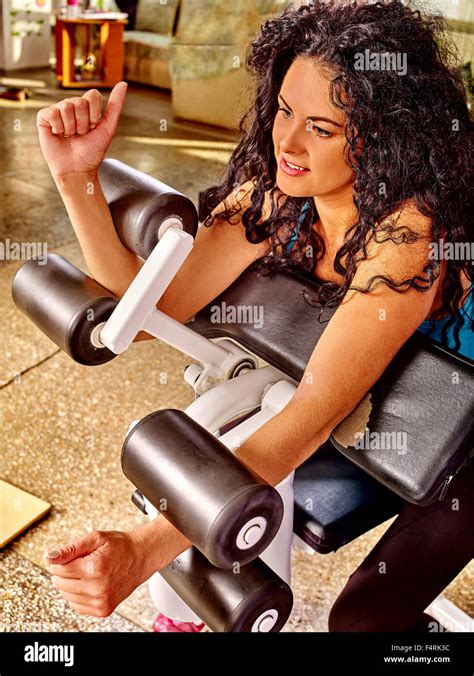 Girl Workout On Bicep Curl Machine In Sport Gym Stock Photo Alamy
