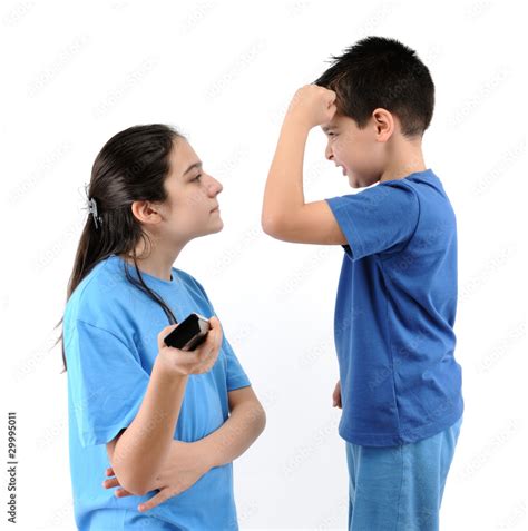 Brother And Sister Fighting Over The Tv Remote Control Isolated Stock