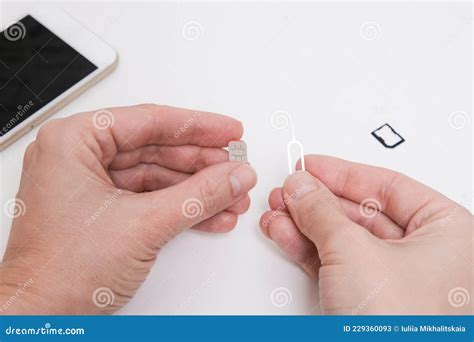 Removing A Sim Card Out Of A Smartphone Replacing Simcard And Changing Number Stock Image
