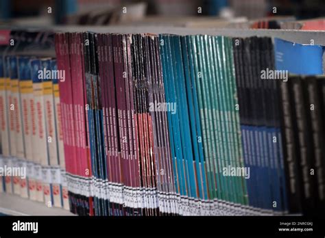 School Textbooks Neatly Arranged On An Iron Shelf In The Air Belo