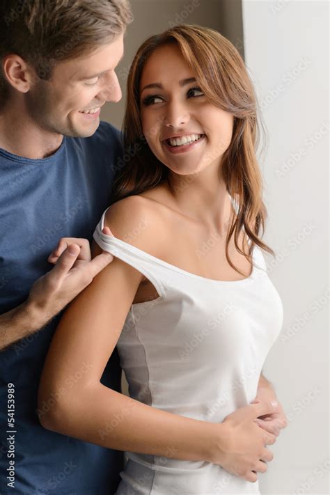 Playful Couple Handsome Young Men Undressing His Girlfriend Stock