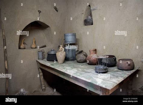 Traditional Pottery And Other Everyday Handcraft Objects On A Table Of