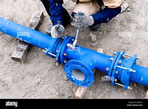 Workers Installing Water Supply Pipeline System Close Up Stock Photo Alamy