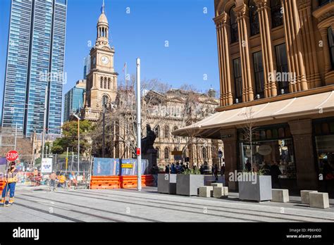 Female Traffic Controller Manages Traffic Along George Street In Sydney