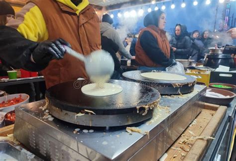 Person Pouring Ladle Batter Into Round Pan Frying Pancakes Cook Making